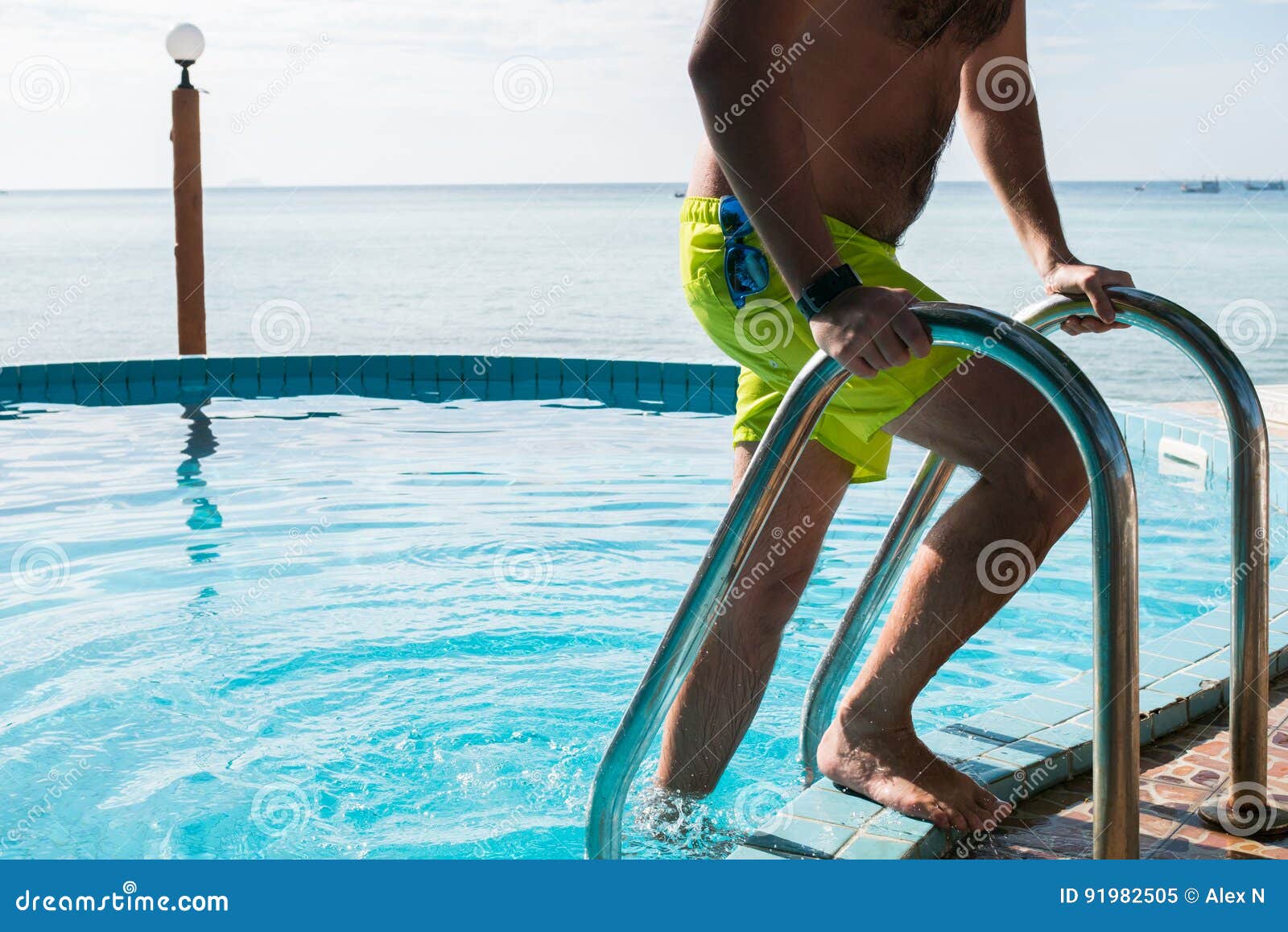 Man walks out of pool stock image. Image of shiny, front - 91982505