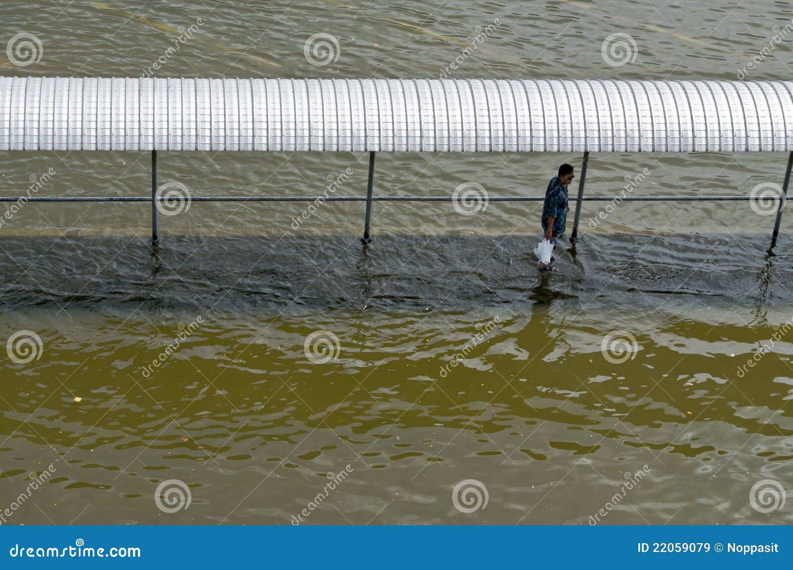 Man on walkway flooding editorial stock image. Image of environment ...