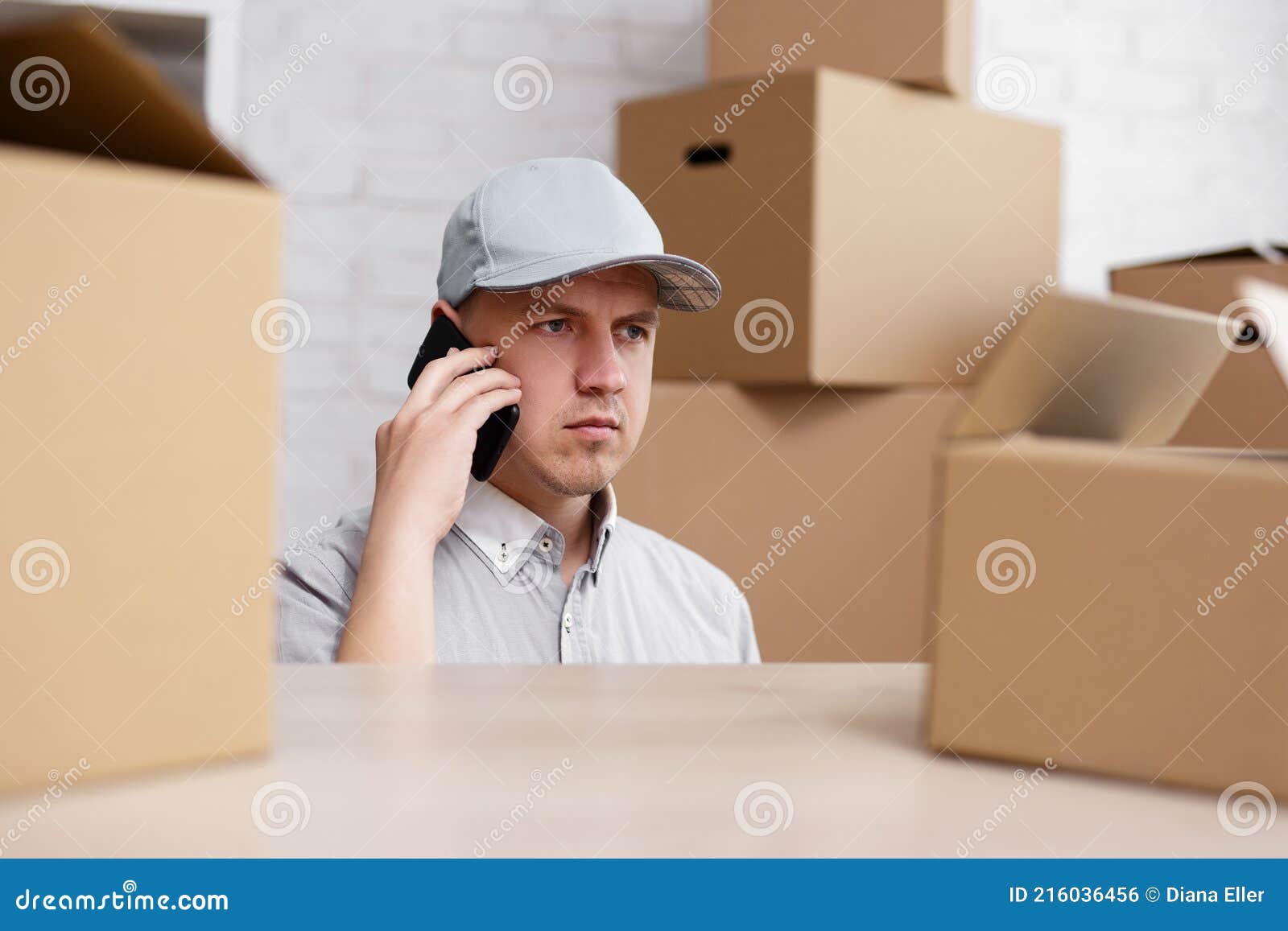 Man in Warehouse Calling by Phone Stock Photo - Image of product ...