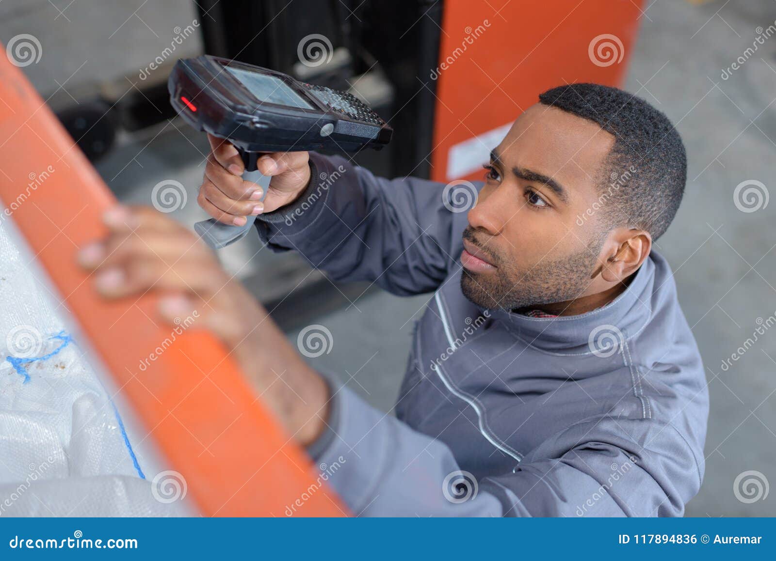 Man in Warehouse Using Electronic Scanner Stock Photo - Image of ...
