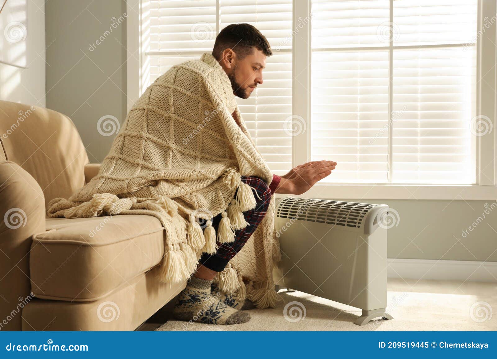 Man Warming Hands Near Electric Heater at Home Stock Image - Image of ...