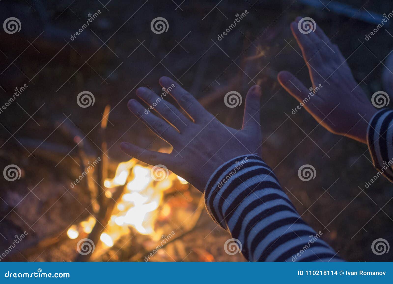 Fire warms up hands stock photo. Image of night, human - 110218114