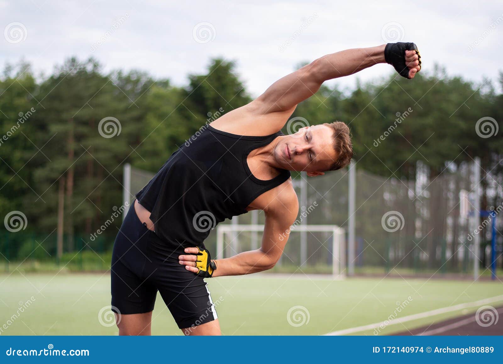 A Man is Warming Up at the Stadium before Training Stock Photo - Image ...