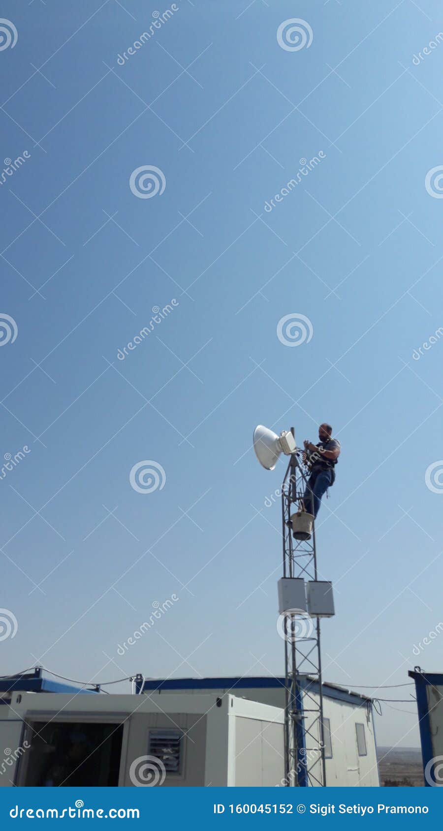 A Man Was in the Tower for Installation of Antenna at Outdoor Area ...