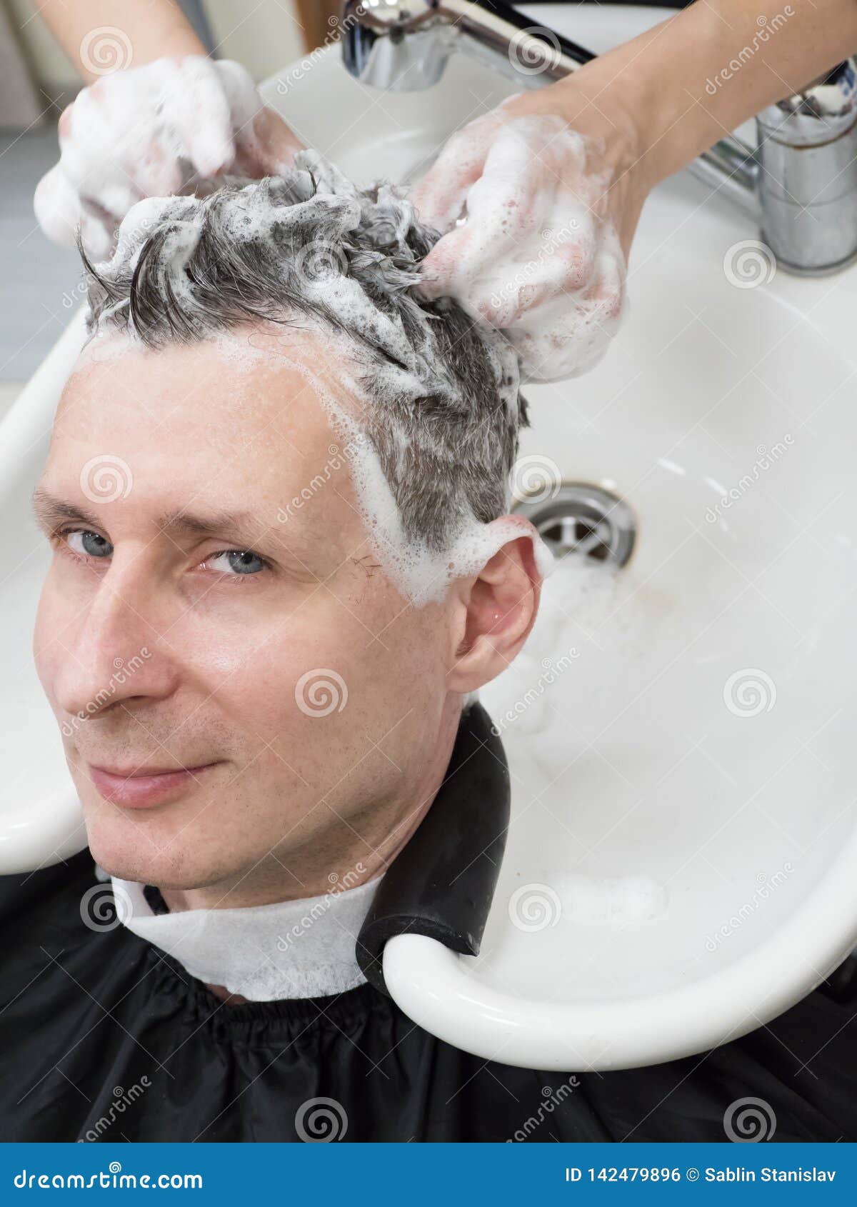 A Man Washes His Hair after a Haircut. Stock Photo - Image of ...