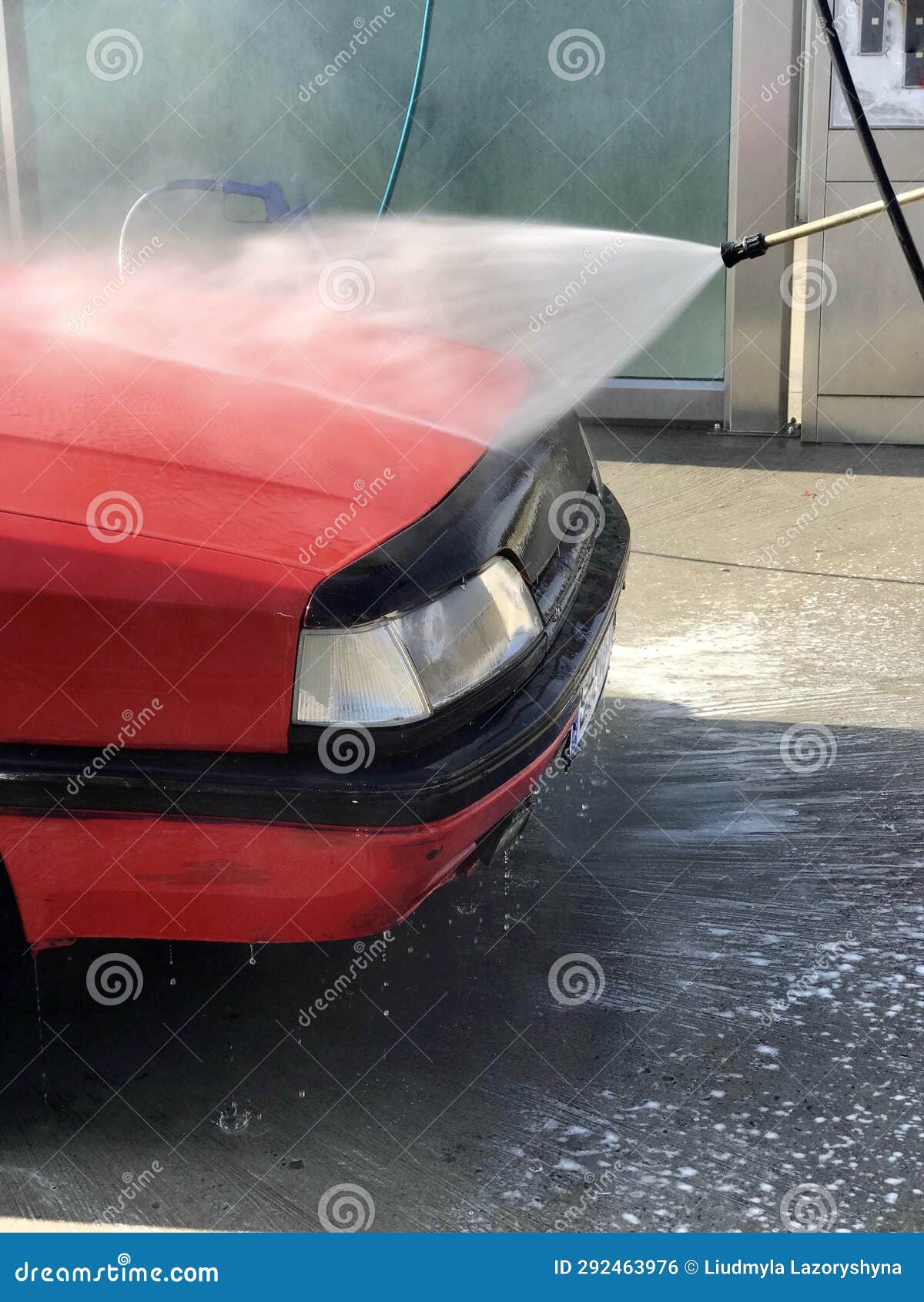 A Man Washes a Red Car at a Car Wash with Detergent Stock Photo - Image ...