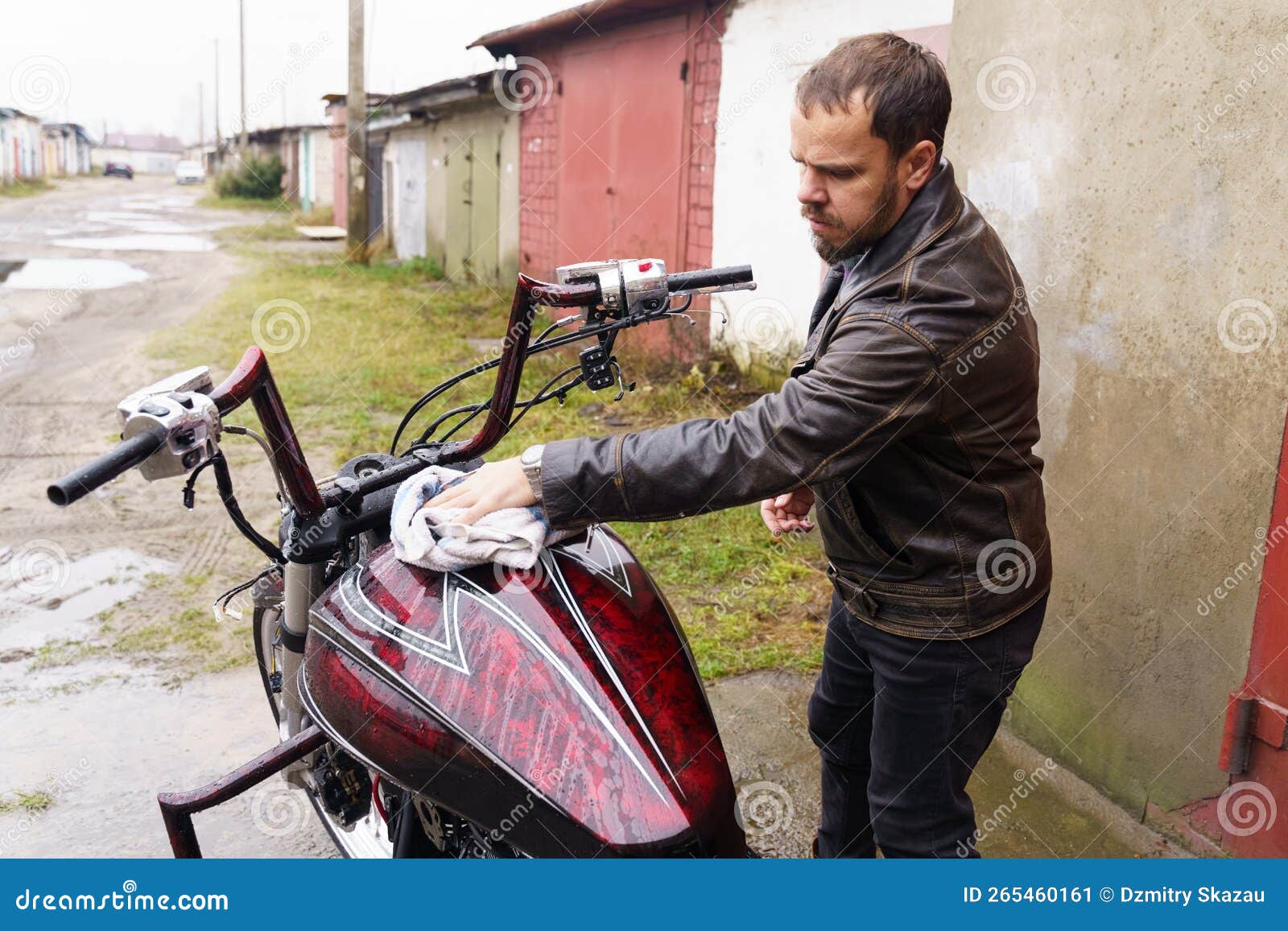 A Man Washes the Tank of a Motorcycle with a Foam Washcloth Stock Image ...
