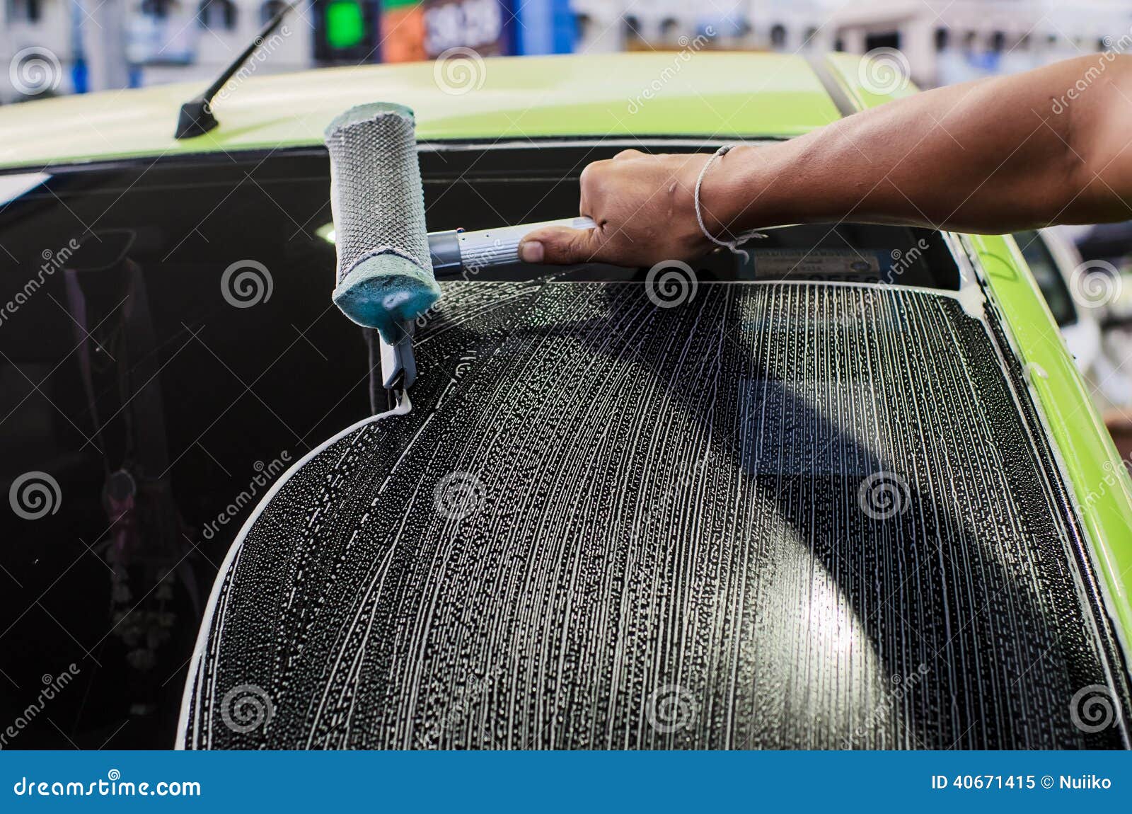 A Man Washing a Car S Window Using a Rag Stock Image - Image of ...