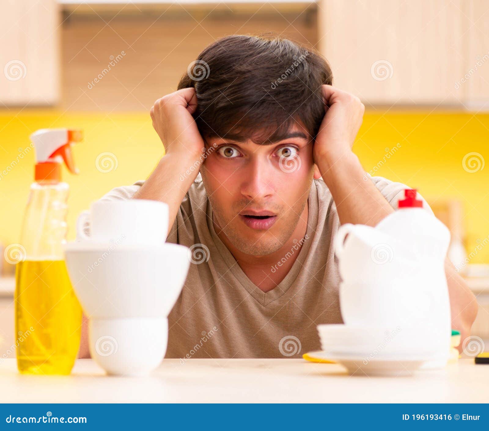 Man washing dishes at home stock photo. Image of housekeeping - 196193416