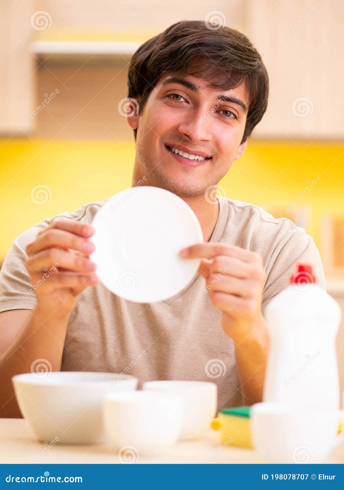 Man washing dishes at home stock image. Image of dish - 198078707