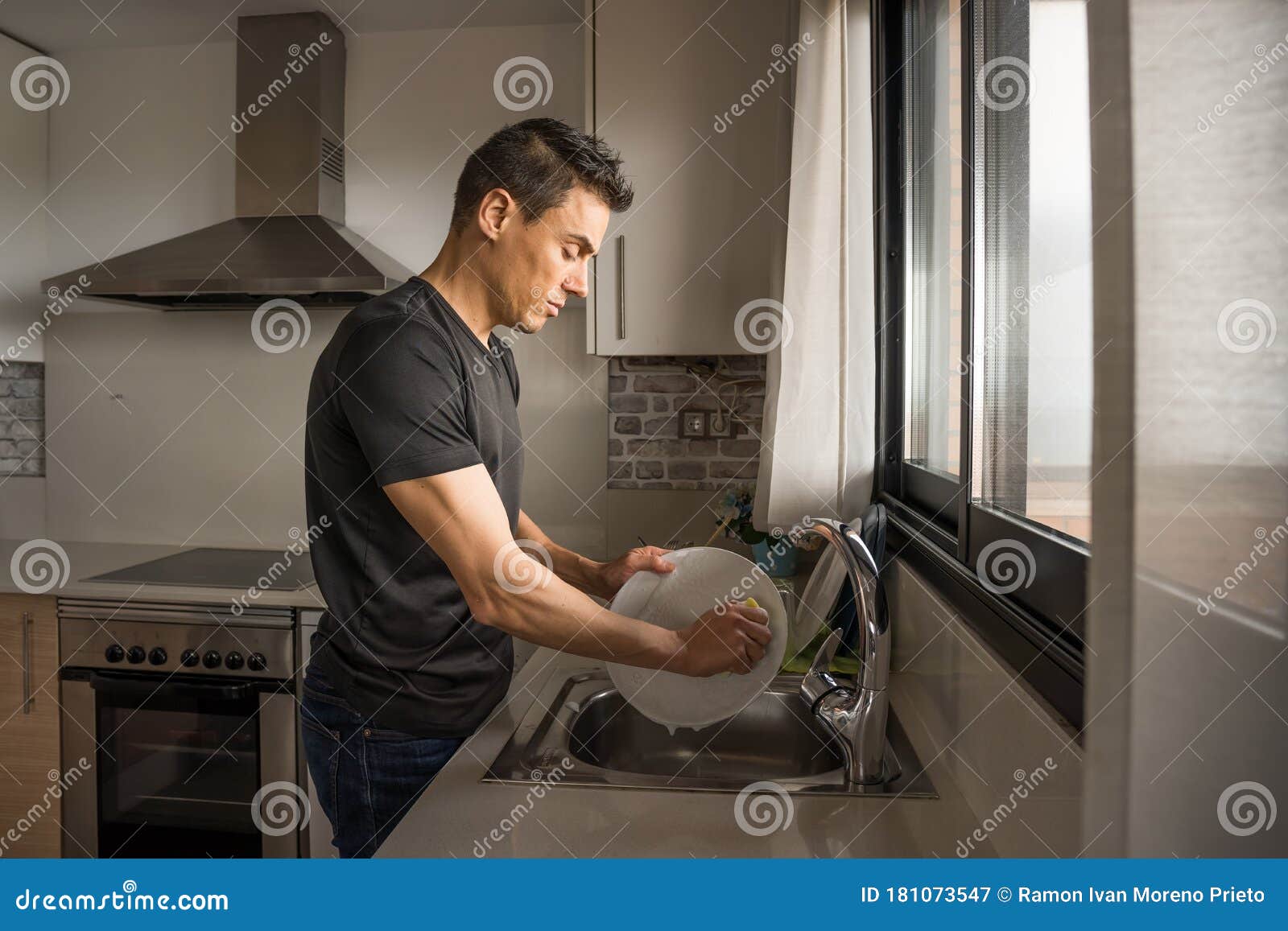 Man Washing Dishes in the Kitchen. Medium Shot Stock Image - Image of ...
