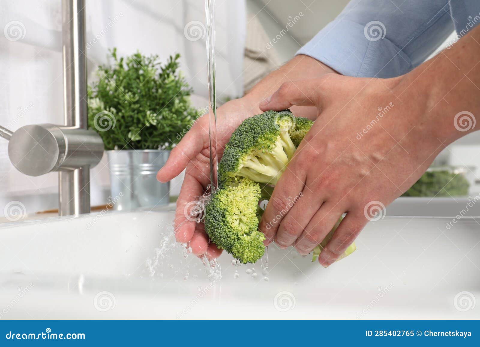 Man Washing Fresh Broccoli in Kitchen, Closeup Stock Image - Image of ...