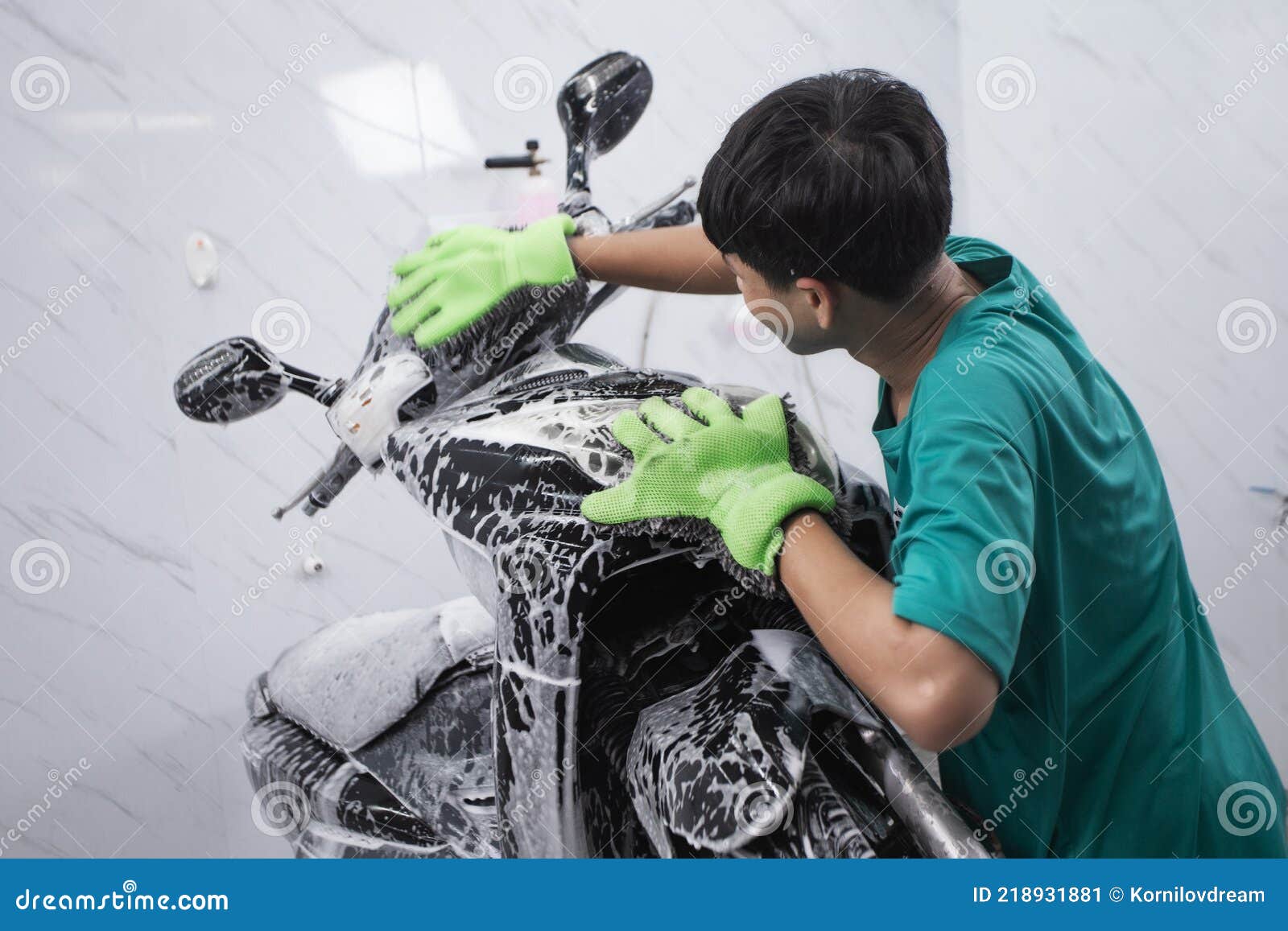 Man Washing His Motorcycle or Scooter with Soap and Sponge Stock Image ...