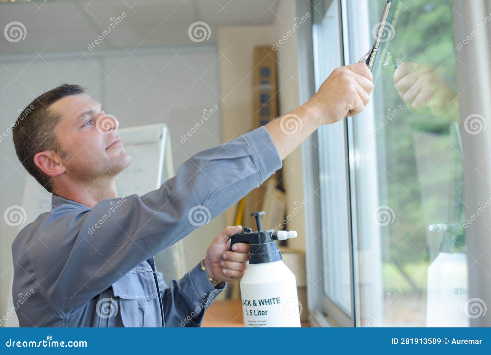 Man Washing Interior Windows Using Squeegee Stock Image - Image of ...