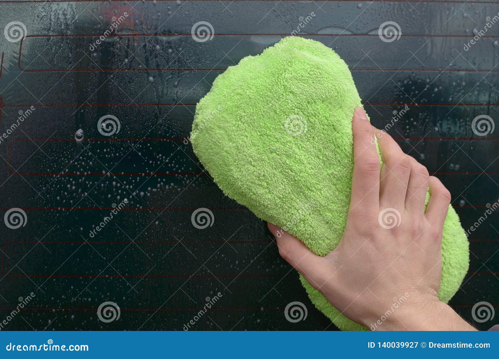 Man washing windshield stock image. Image of finish - 140039927