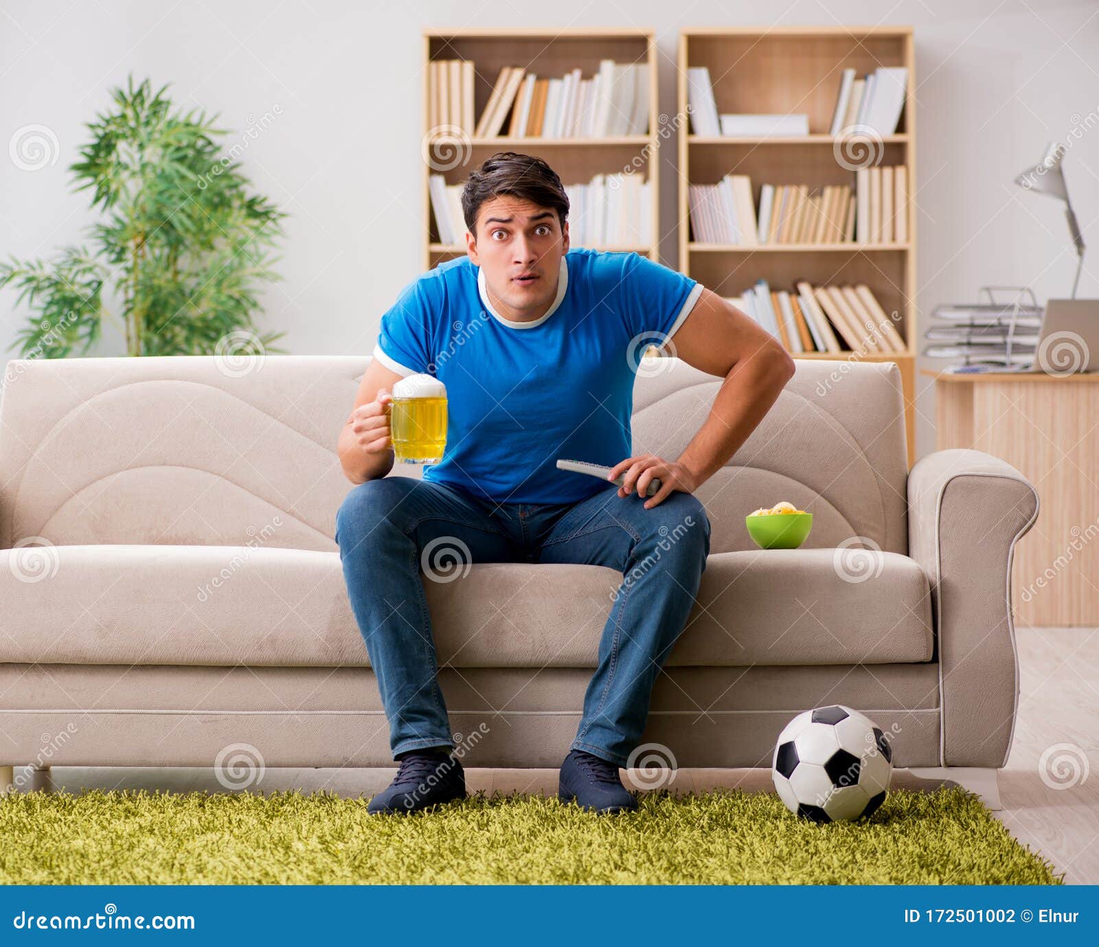 Man Watching Football at Home Sitting in Couch Stock Photo - Image of ...