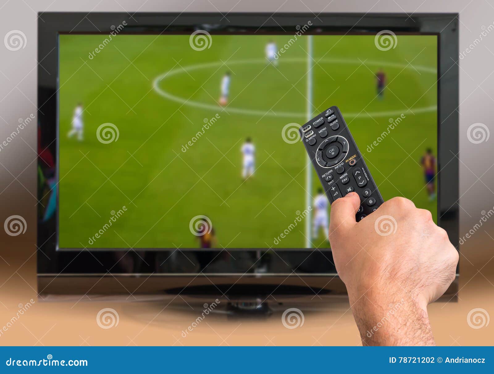 Man Watching Football On Tv