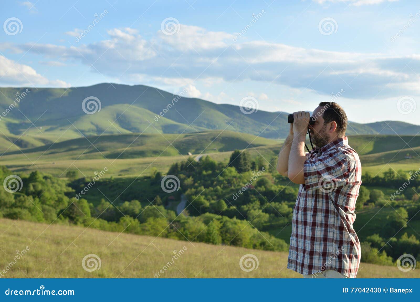 Man Watching Landscape through Binoculars Stock Photo - Image of ...