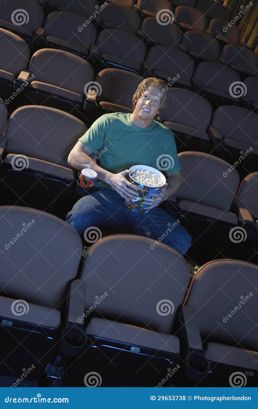 Man Watching Movie in Theater Stock Photo - Image of audience ...