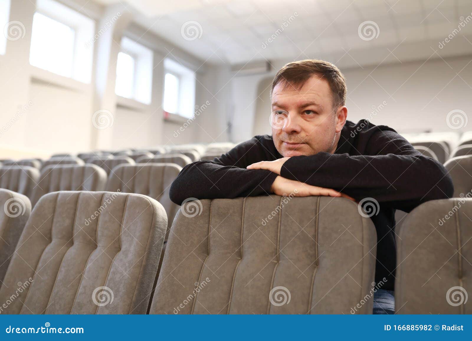 Man watching performance stock photo. Image of audience - 166885982