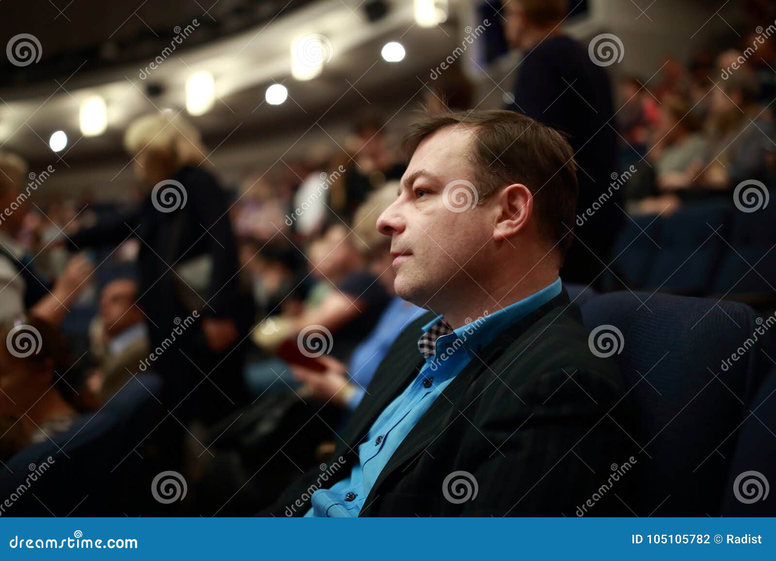 Man watching a play stock photo. Image of comfortable - 105105782