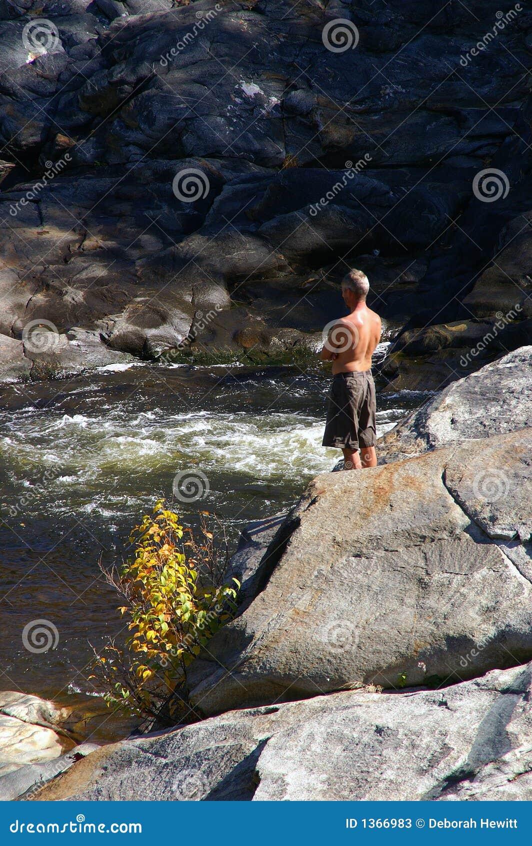 Man Watching River from Rocks Stock Image - Image of water, overlook ...