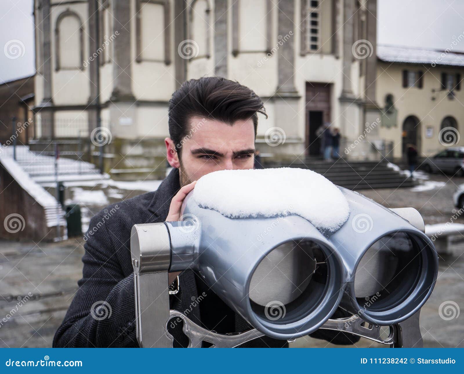 Man Watching Sights through Binoculars Stock Photo - Image of ...