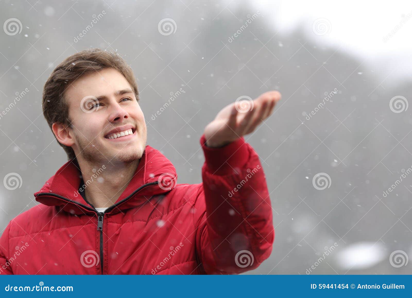 Man Watching the Snow Falling on His Hand in Winter Stock Photo - Image ...