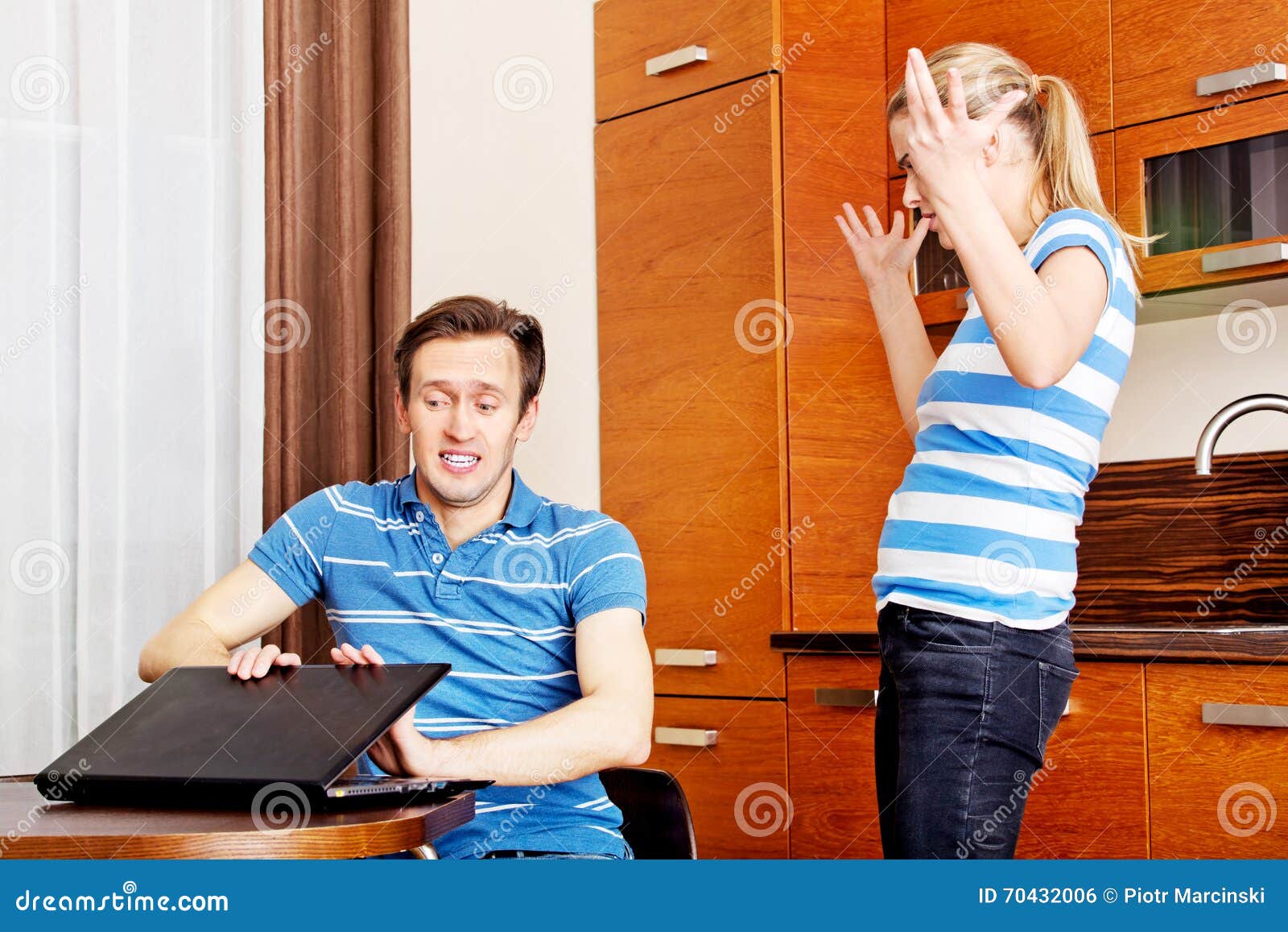 Man Watching Something on Laptop, His Wife is Angry Stock Photo - Image ...