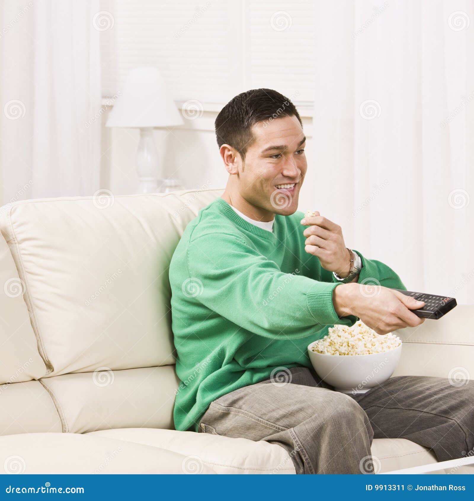 Man Watching Television stock image. Image of latin, apartment - 9913311