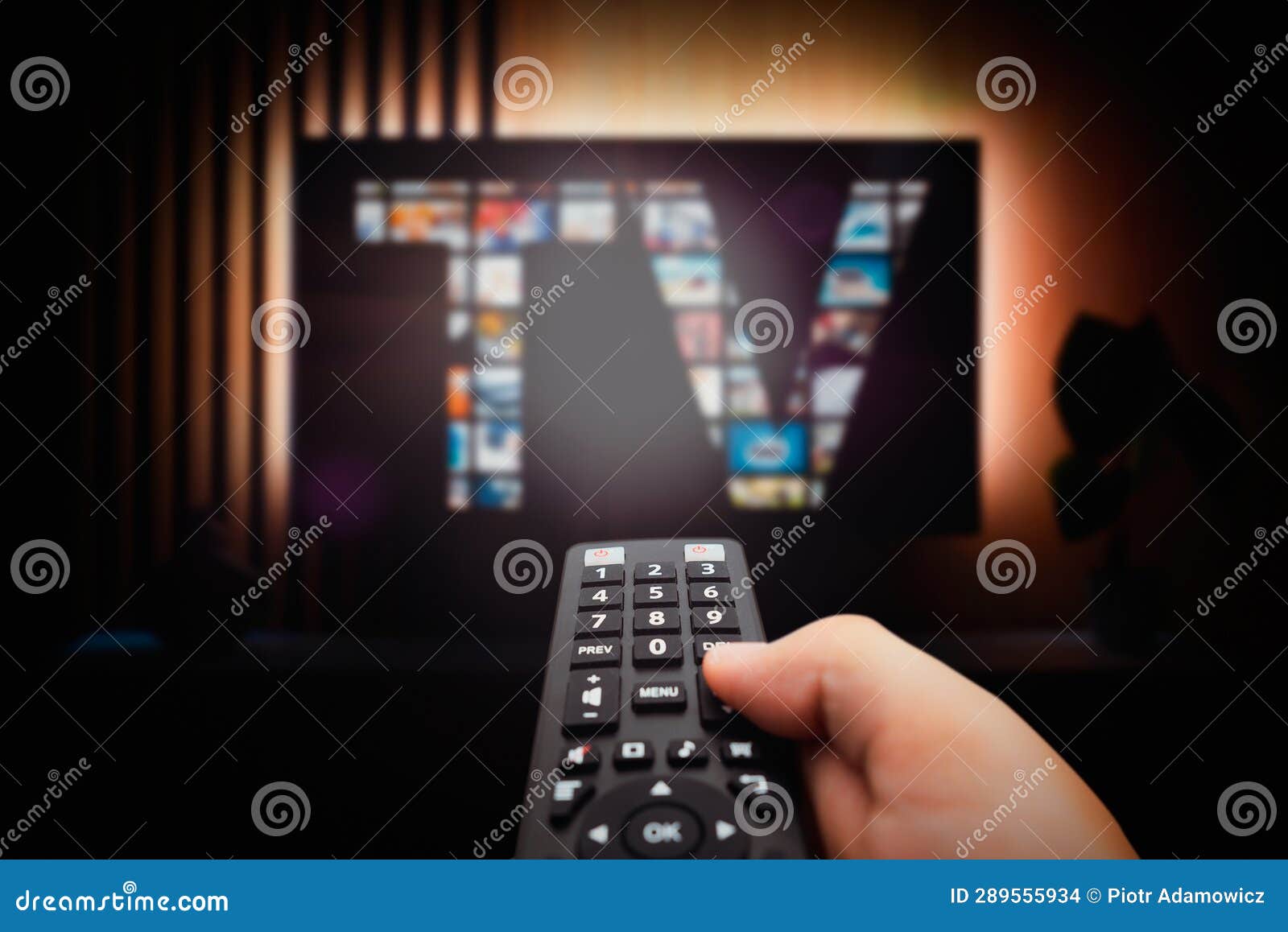 Man Watching TV with Remote Control in Hand Stock Photo - Image of ...