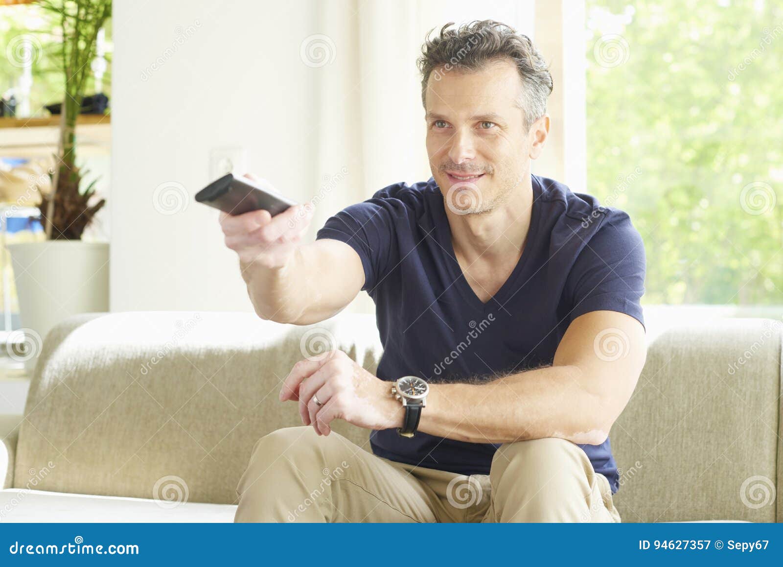 Man watching the tv stock image. Image of person, house - 94627357