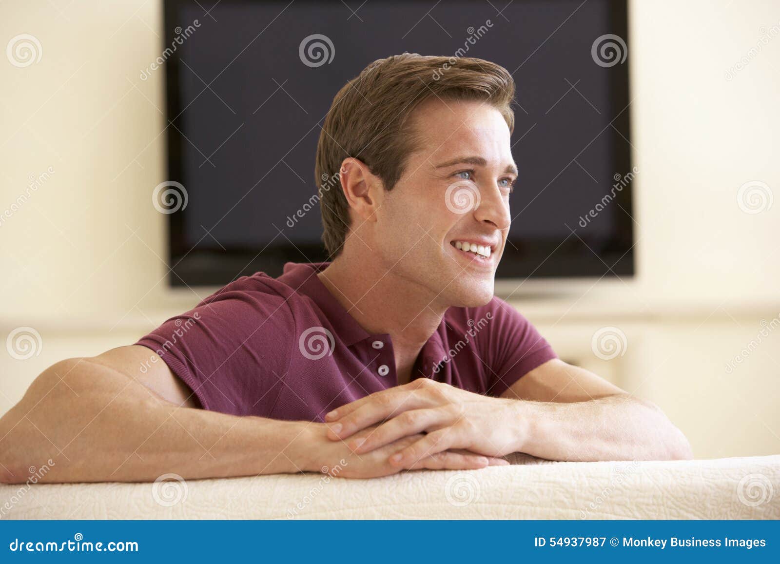 Man Watching Widescreen TV at Home Stock Image - Image of lounge ...