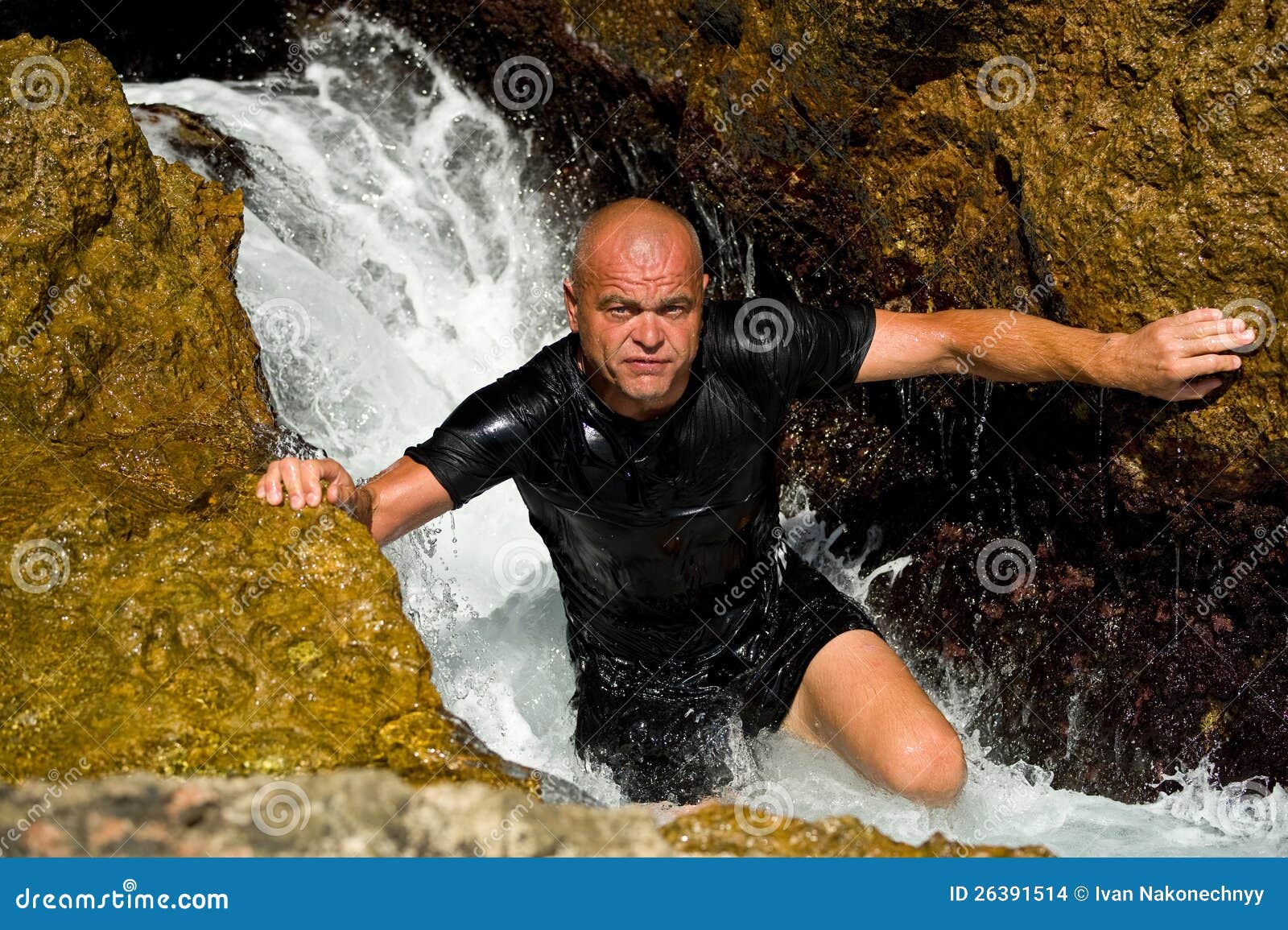 Man and water stock photo. Image of rock, wave, open - 26391514