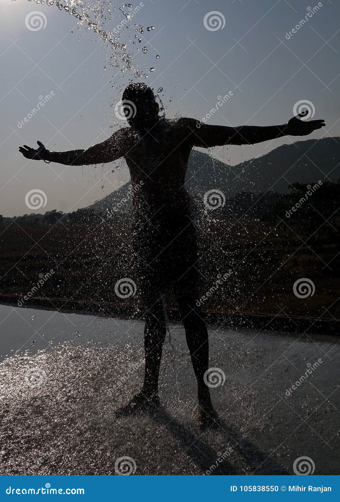A man with water splashes. stock photo. Image of splashesit - 105838550