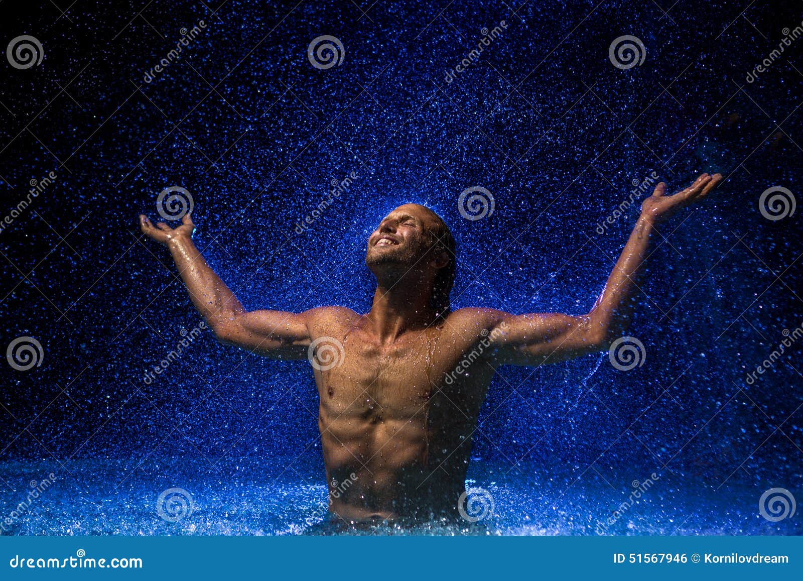 Man in water under rain stock photo. Image of person - 51567946