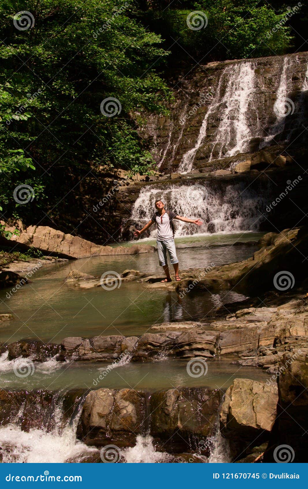 Man on a waterfall stock image. Image of explore, beauty - 121670745