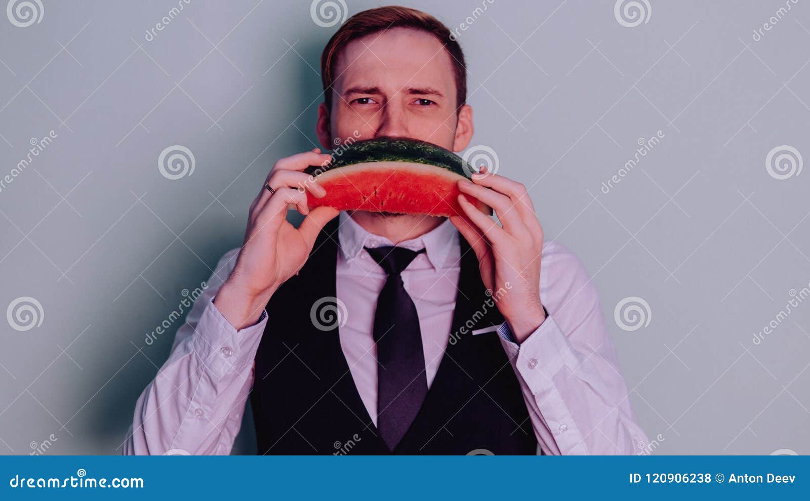 A Man and a Watermelon / Boy in Classic Suit with a Watermelon Stock ...