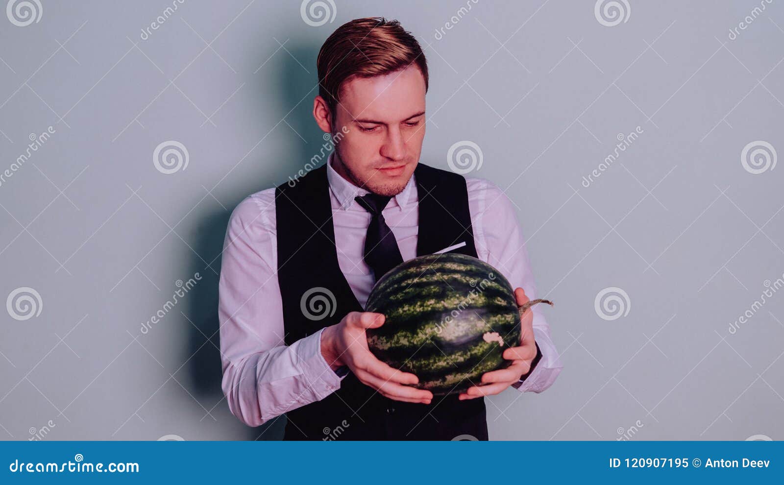 A Man and a Watermelon / Boy in Classic Suit with a Watermelon Stock ...