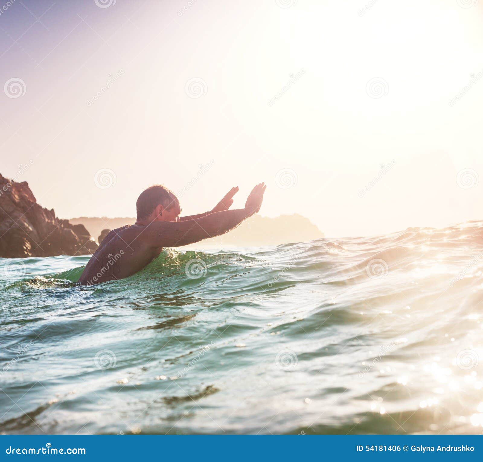 Man in the wave stock photo. Image of swimming, person - 54181406
