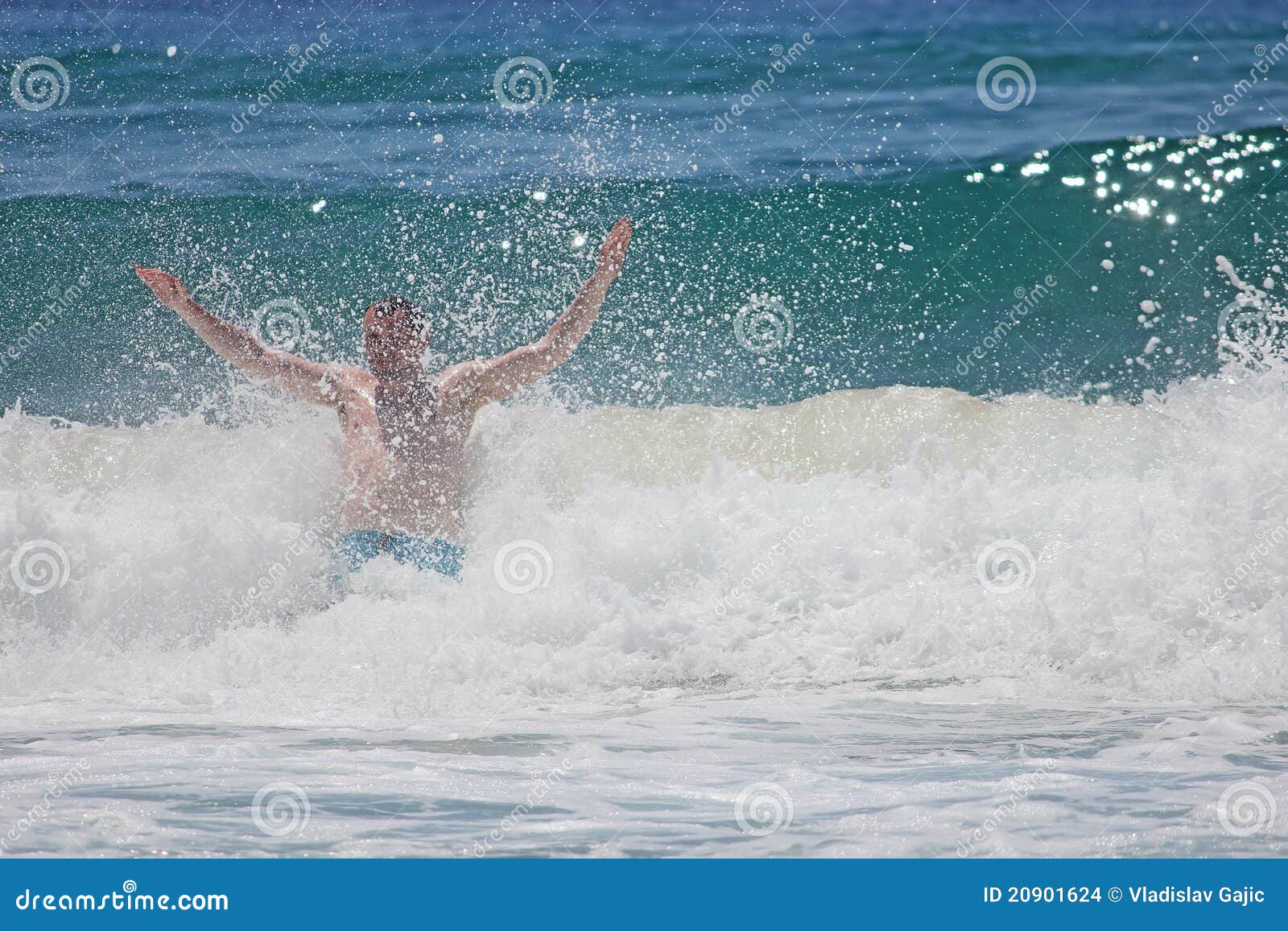 Man in the waves stock photo. Image of breaking, beach - 20901624