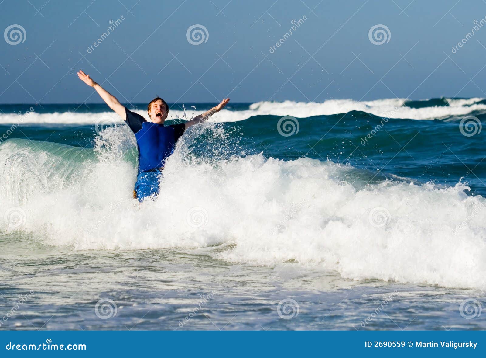 Man in waves stock image. Image of tropical, beach, ocean - 2690559