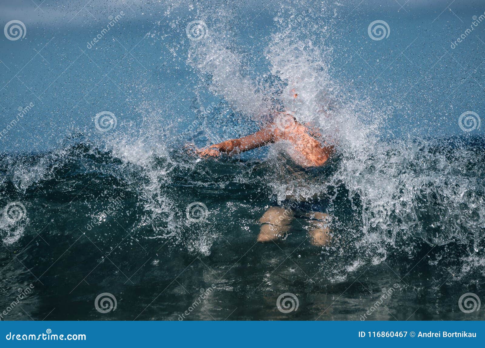 Man in waves of sea stock image. Image of action, happy - 116860467