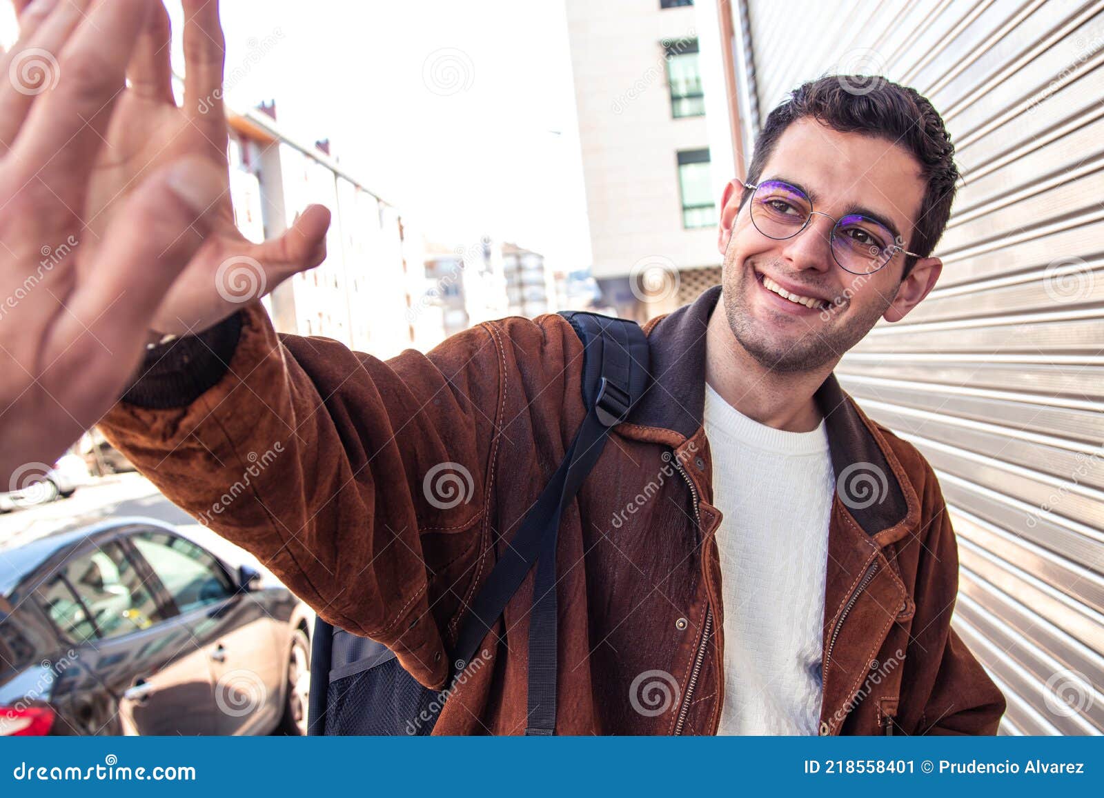 Man waving in the street stock image. Image of confident - 218558401