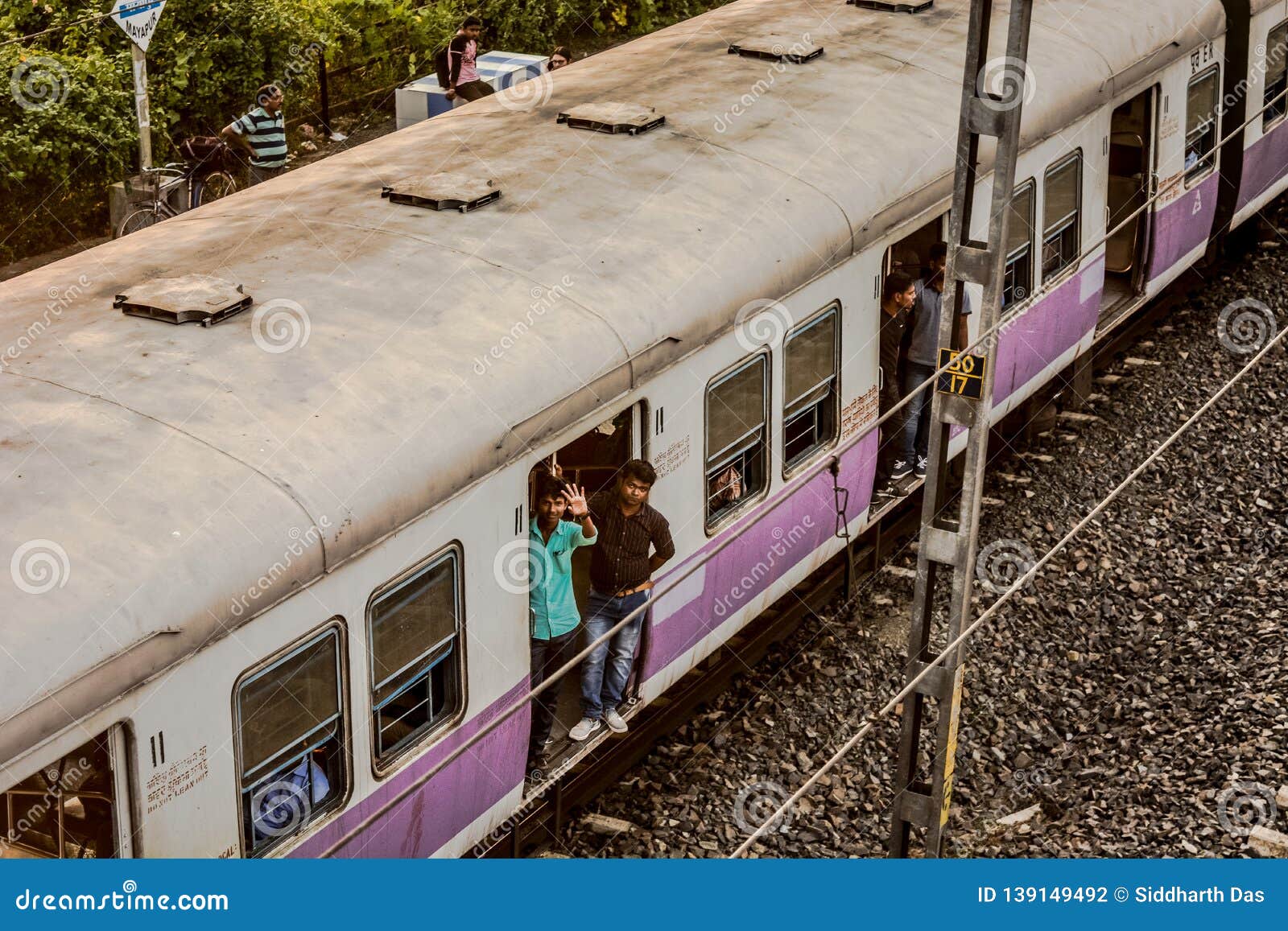 Man Waving while Travelling in a Train Editorial Photography - Image of ...