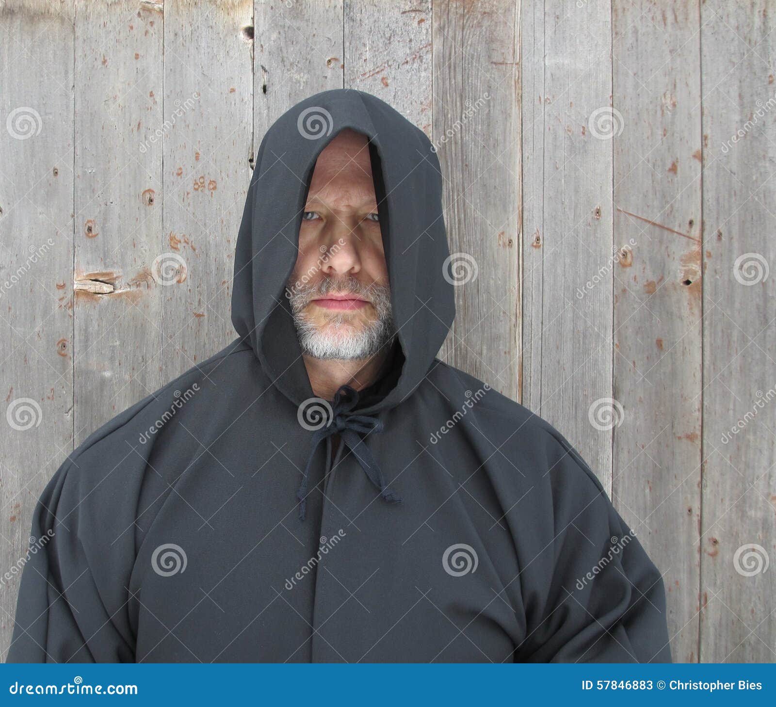 Man Wearing a Black Hooded Cape Stock Image - Image of grey, bearded ...