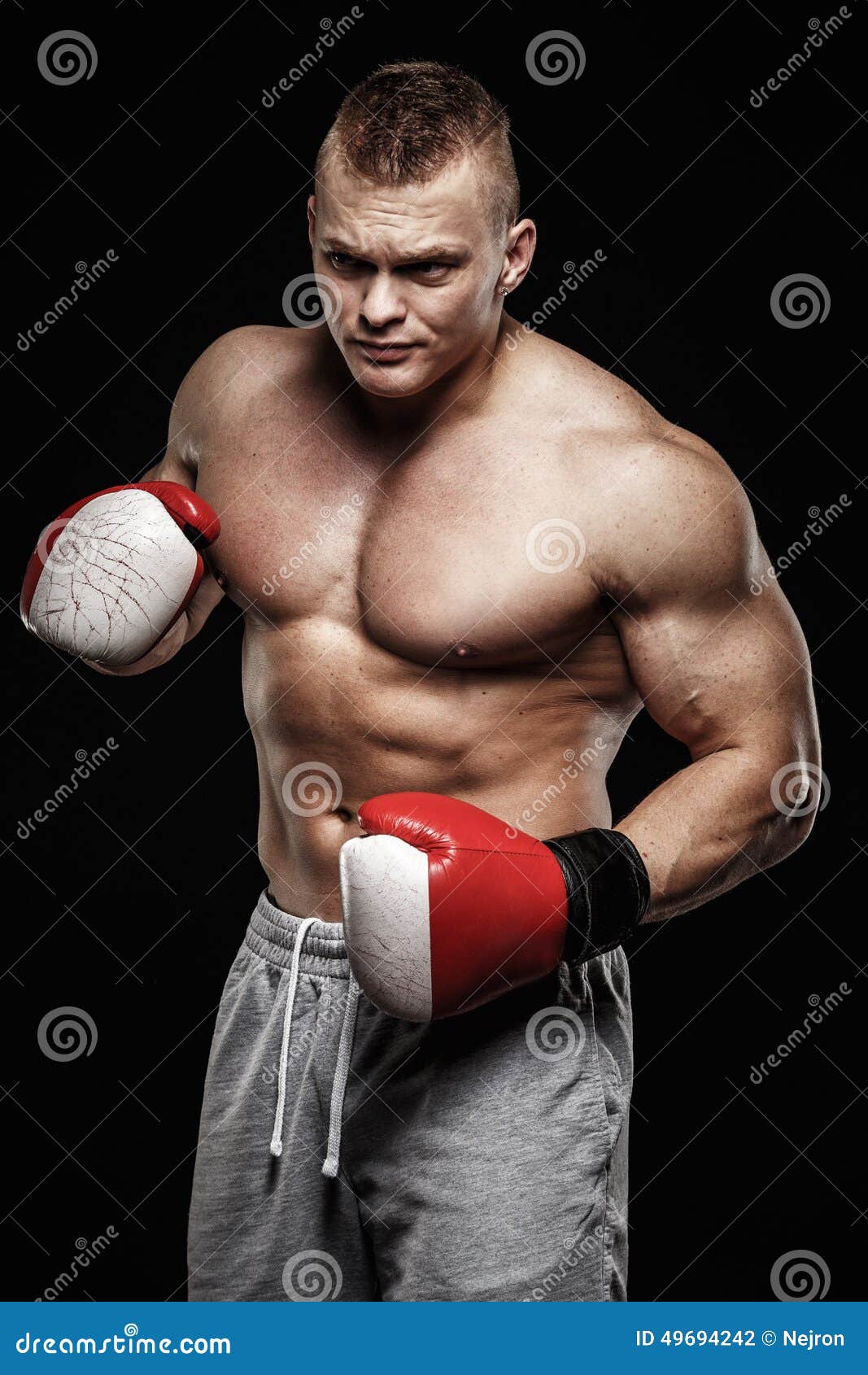 Man wearing boxing gloves stock photo. Image of bodybuilder - 49694242
