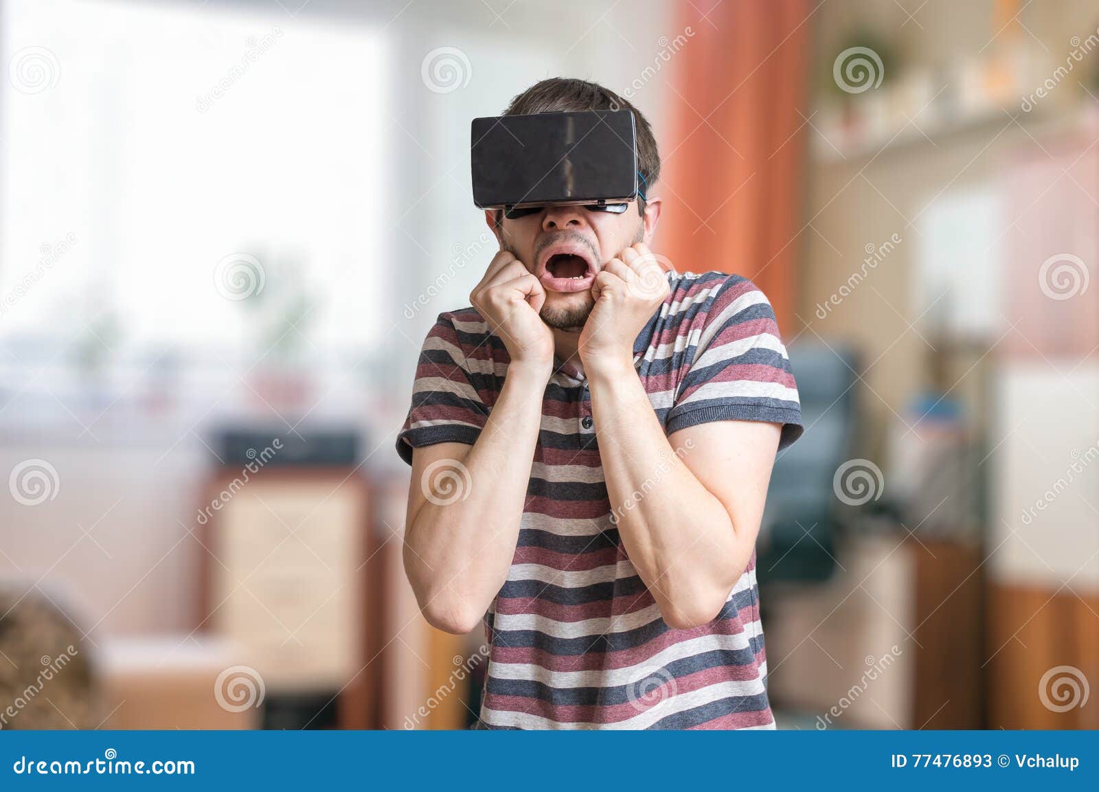 Man is Wearing 3D Virtual Reality Headset and is Scared of Something ...