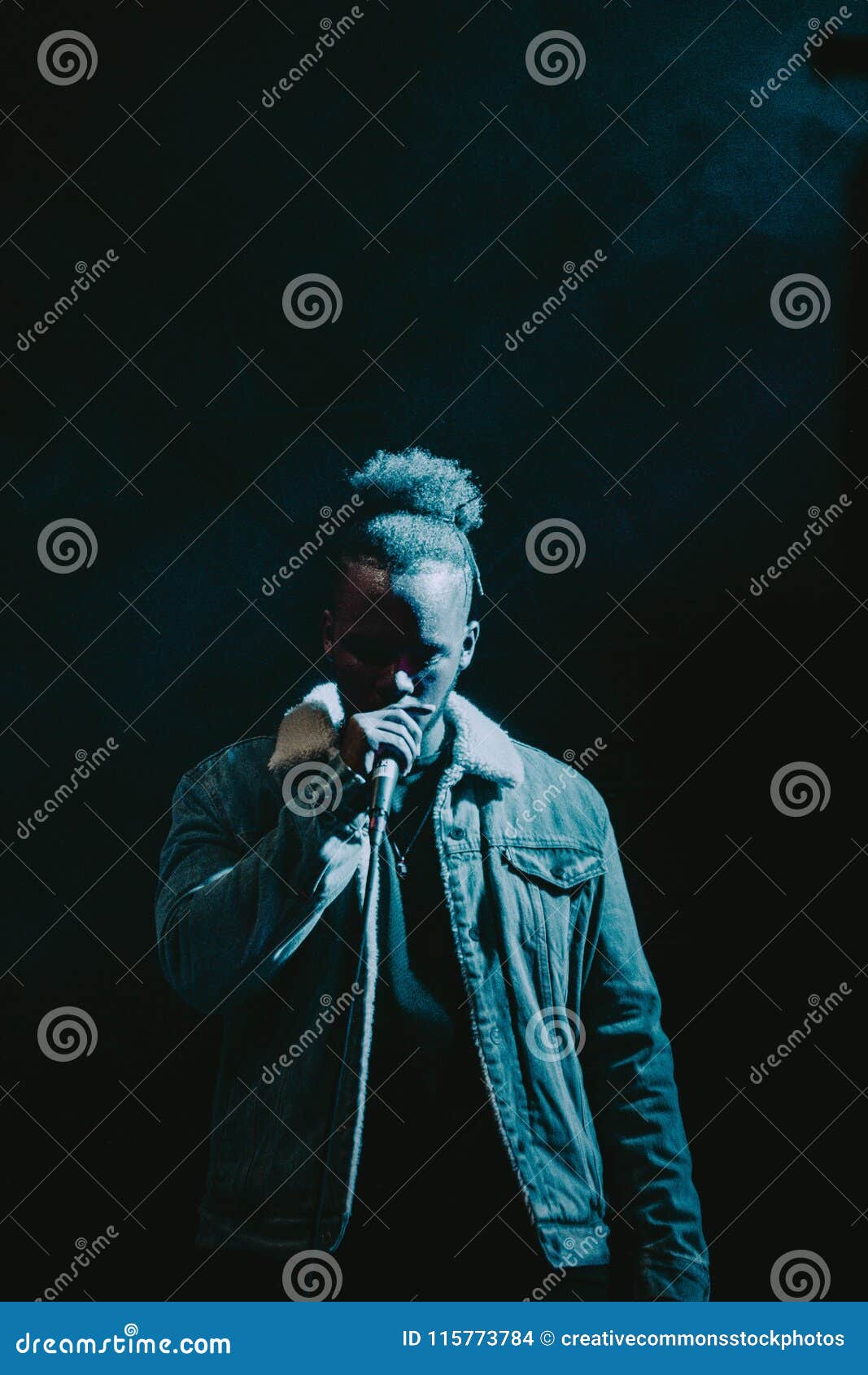 Man Wearing Denim Jacket Singing On Stage Picture. Image: 115773784