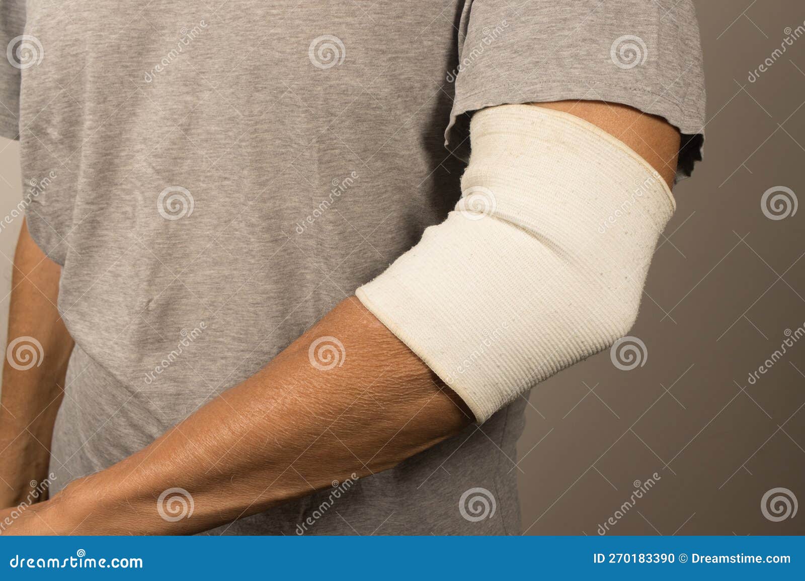 Man Wearing an Elastic Bandage on His Elbow Stock Photo - Image of ...